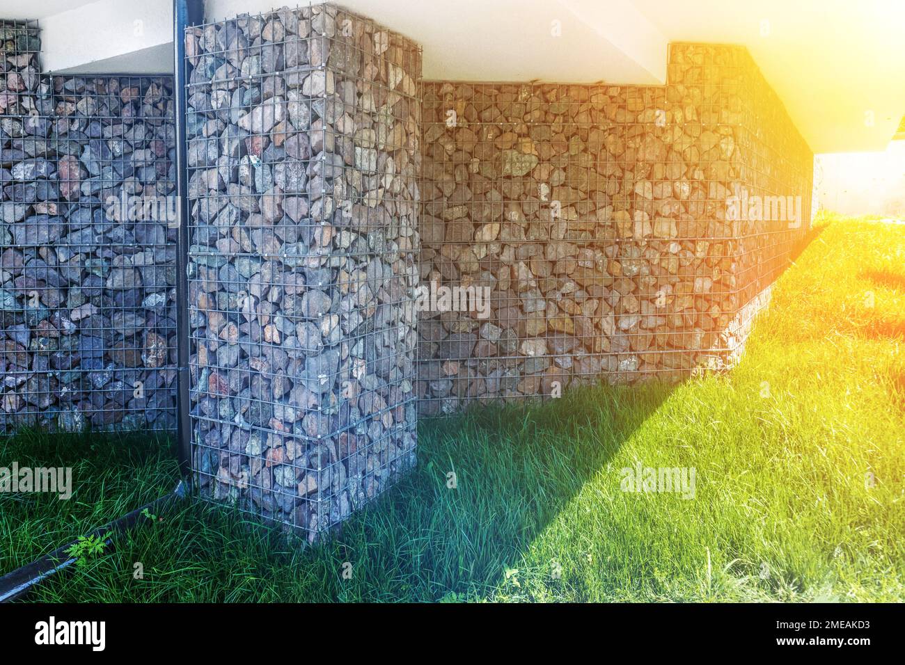 Finishing the basement of the cottage with natural stone in the form of ...