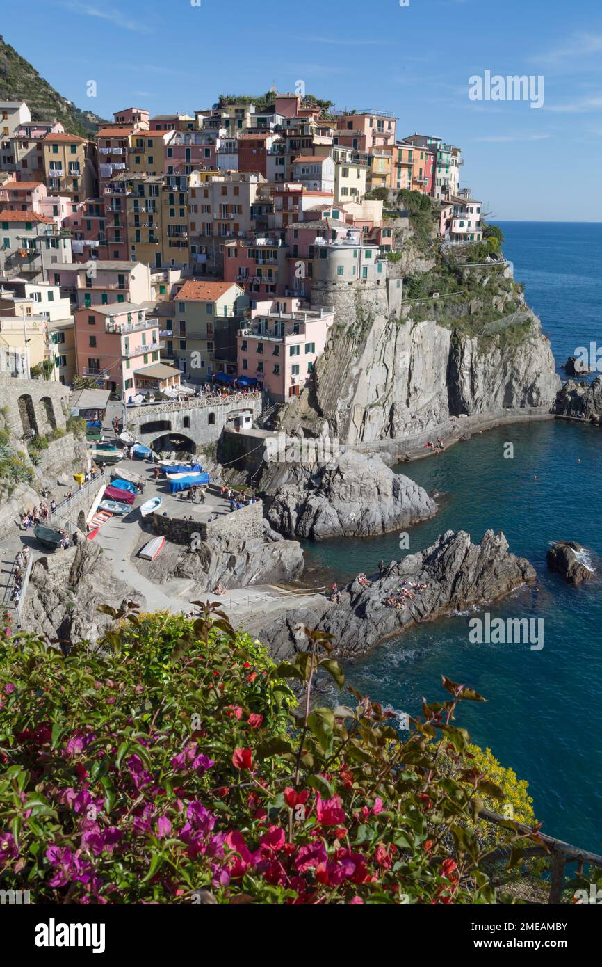 Vertical view of cliffside village of Manarola in spring, Cinque Terre ...