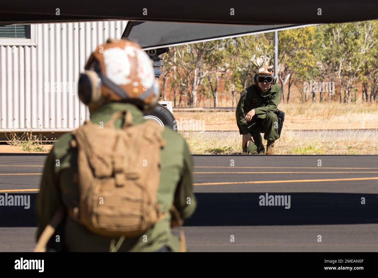 U.S. Marine Corps Cpl. Gavin Saylor communicates to Cpl. Angel Becerra ...