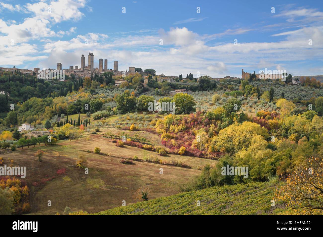 Picturesque Tuscan landscape with colourful rolling hills and the ...