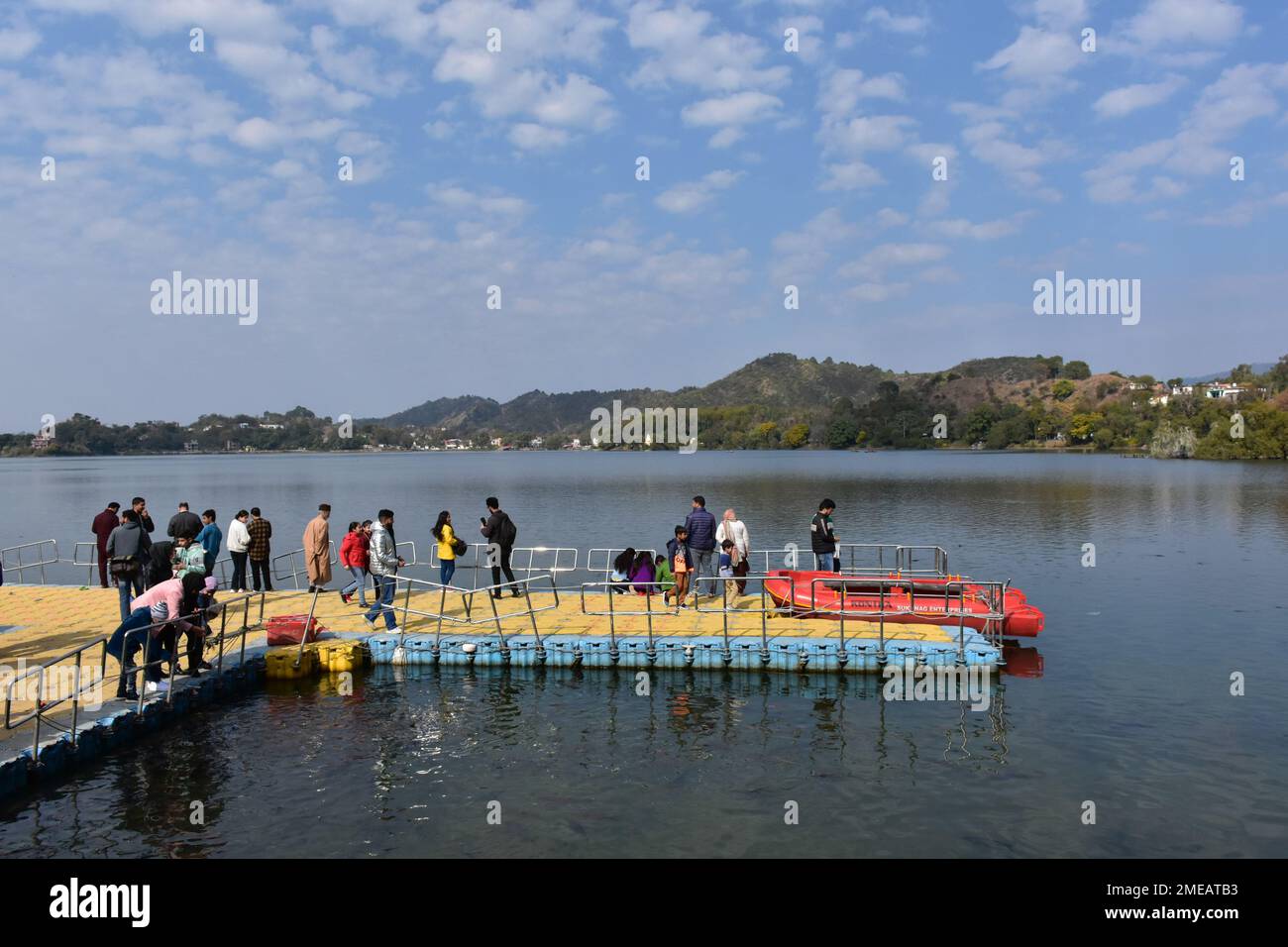 Mansar Lake, India. 24th Jan, 2023. Visitors walk along the jetty as ...