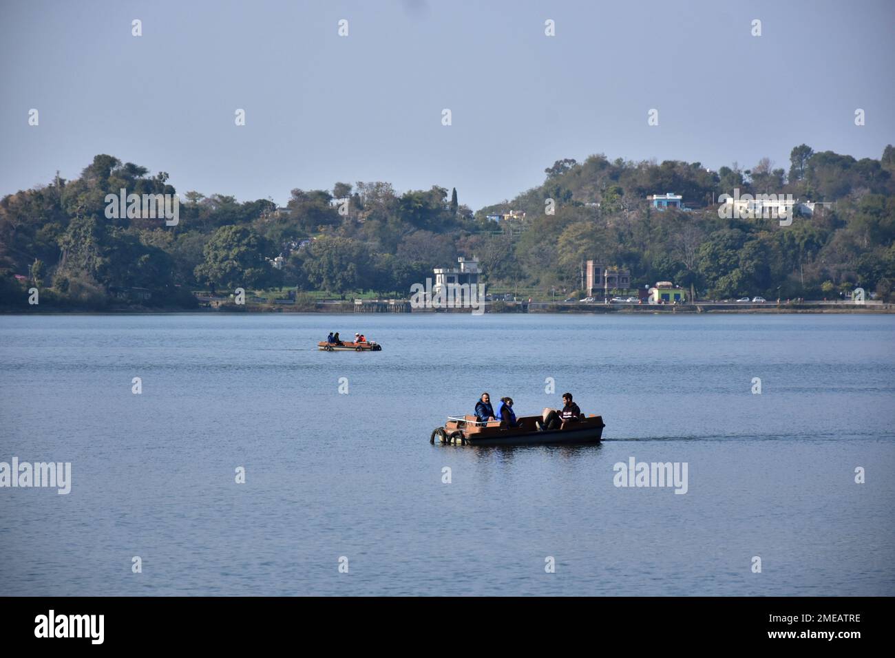 Mansar Lake, India. 24th Jan, 2023. Visitors enjoy boat ride across the ...