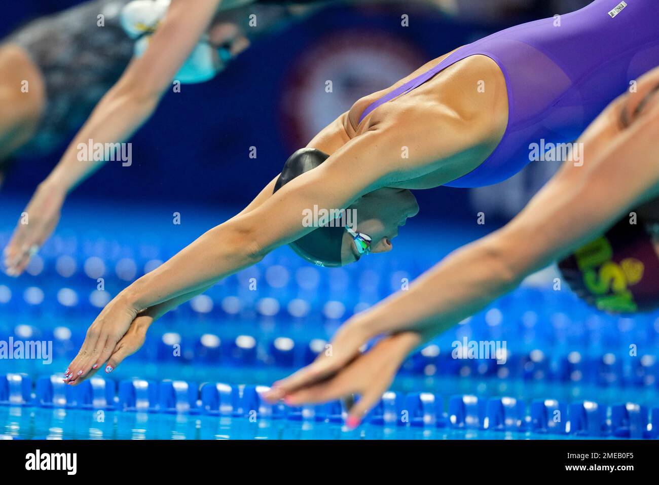 Leah Smith dives at the start of a semifinal heat in the women's 200 ...