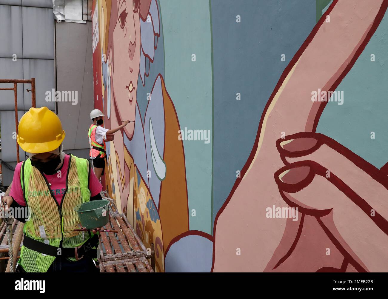 Indonesian artists make finishing touches to a large gender equality ...
