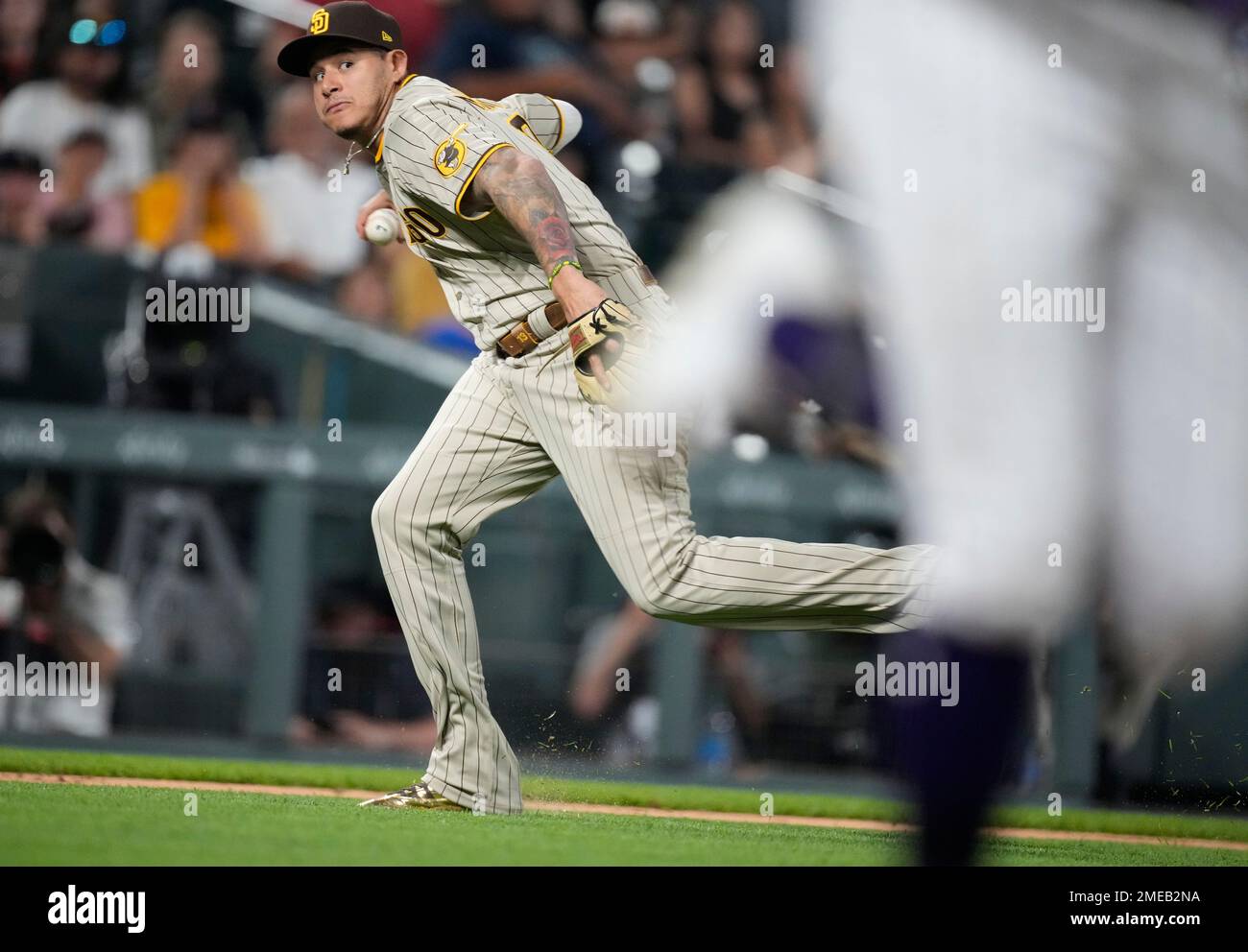 San Diego Padres third baseman Manny Machado looks to throw after ...