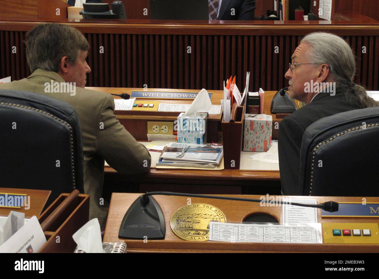 Alaska Senate Minority Leader Tom Begich, right, speaks with Sen. Bill ...