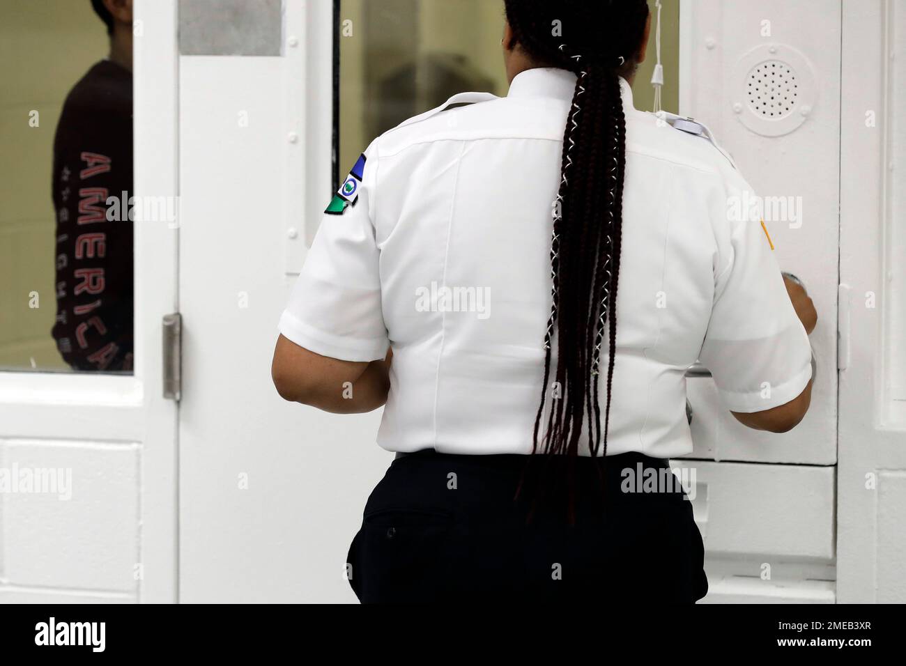 In this photo taken Sept. 10, 2019, a detainee wearing a shirt that ...