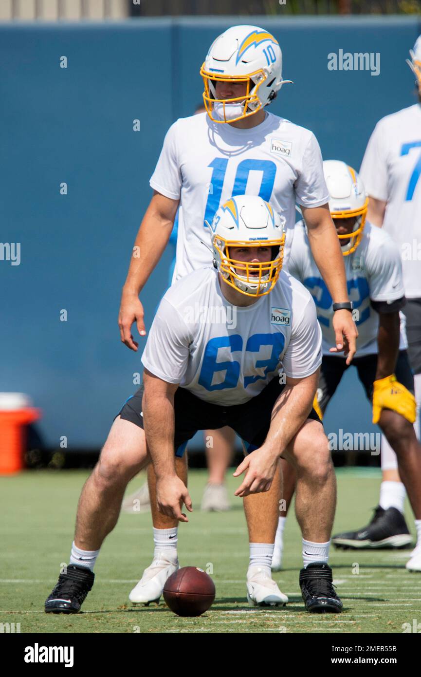 Los Angeles Chargers center Corey Linsley, front, and quarterback ...