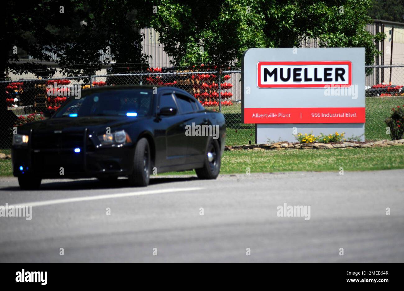 A police car guards the entrance to a Mueller Co. fire hydrant plant where police said multiple ...