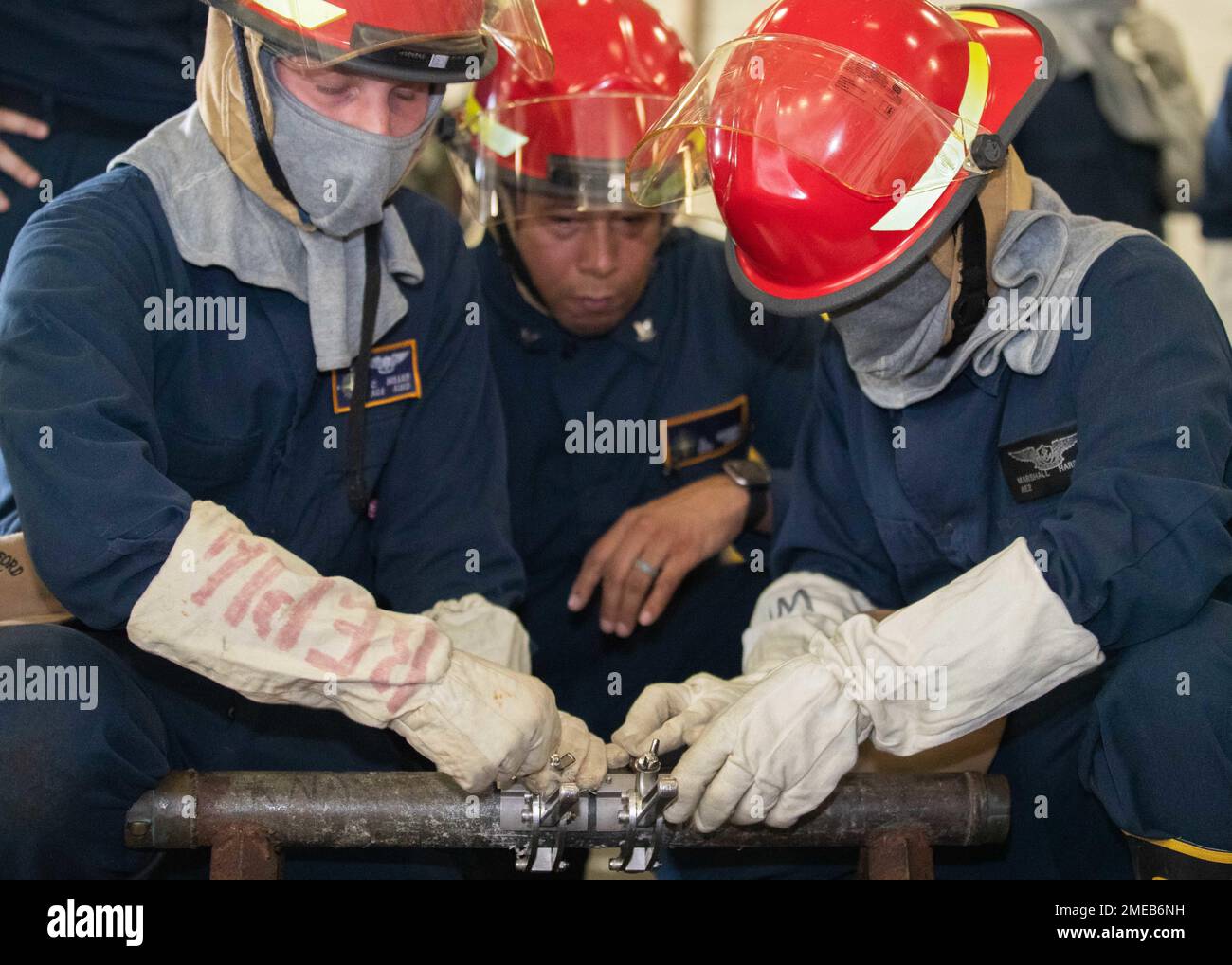 Sailors assigned to USS Gerald R. Ford (CVN 78), demonstrate pipe ...