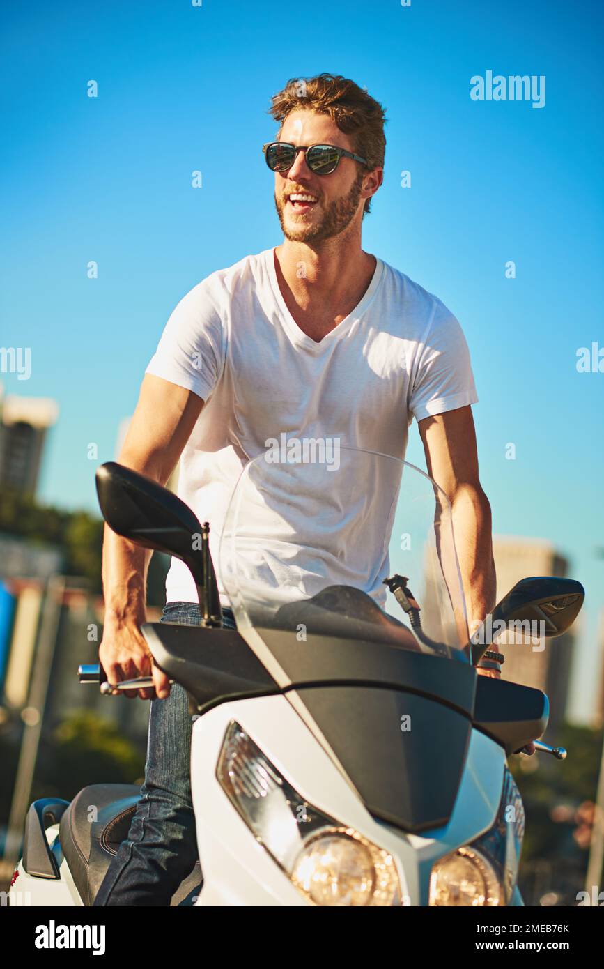 Because riding a motorcycle is so much cooler. a young man riding a ...