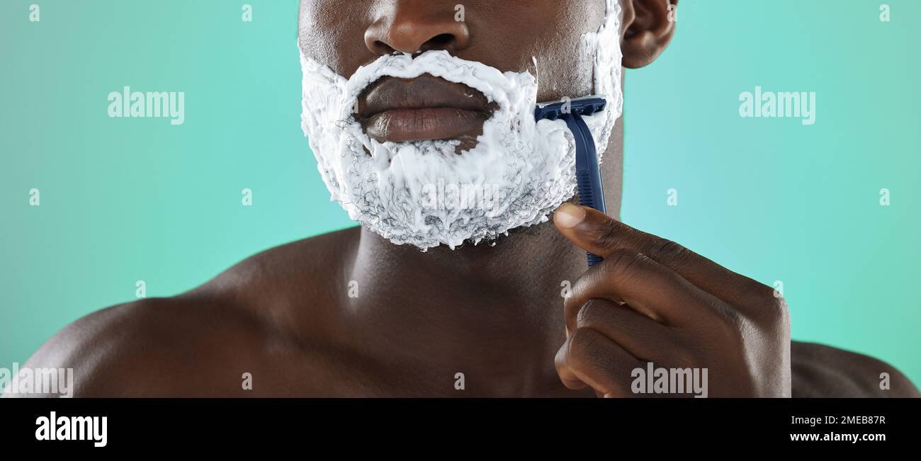 Black man, shaving and cream in studio for skincare, razor and facial cosmetics for beauty by ...