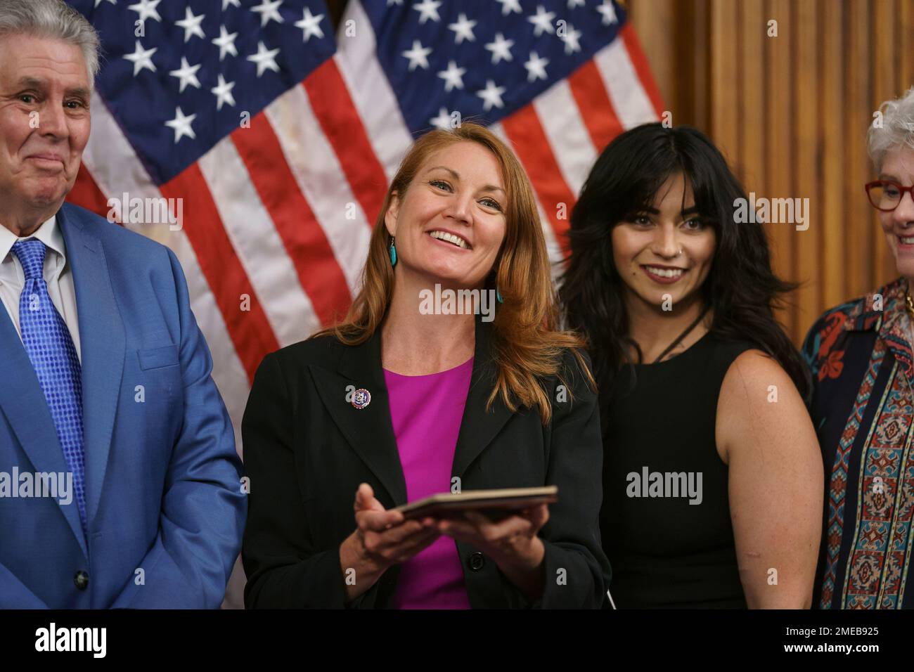 Rep. Melanie Stansbury, D-N.M., center, smiles as she is joined by her ...