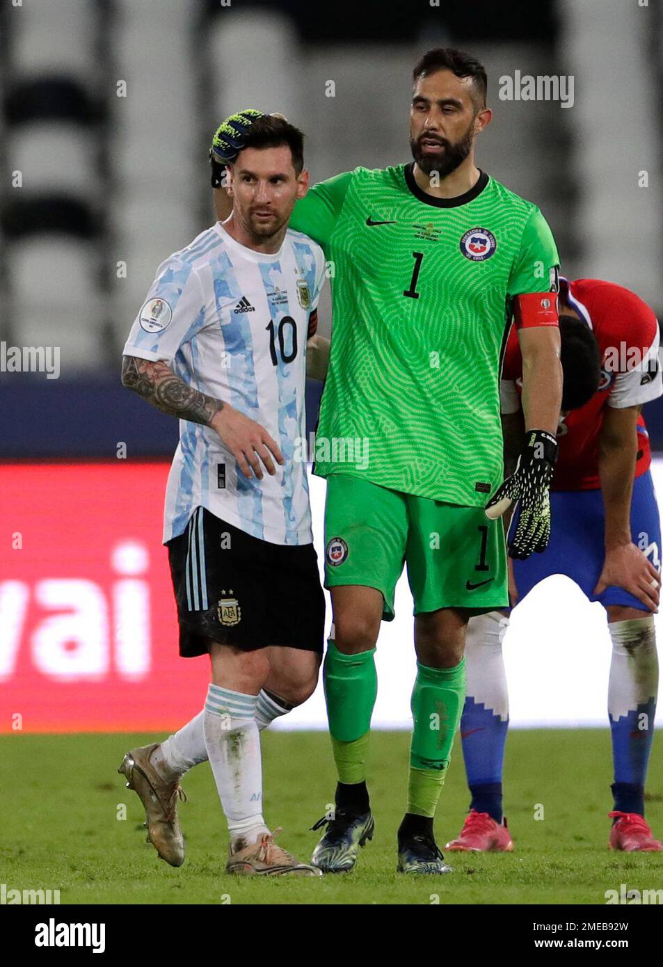 Chile's goalkeeper Claudio Bravo, right, greets Argentina's Lionel ...