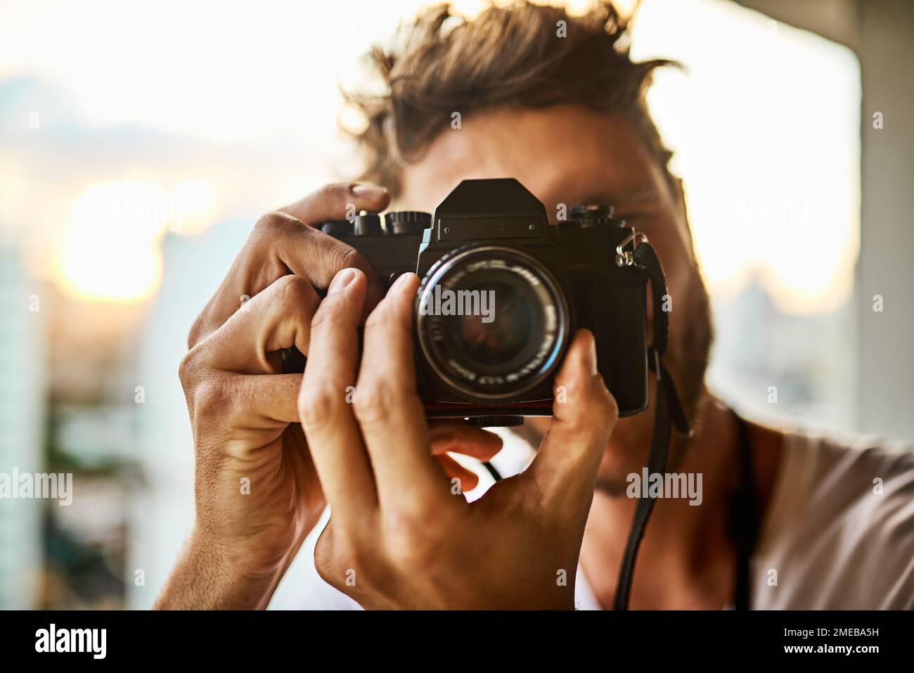 Capturing moments worth capturing. a young man taking photographs of ...