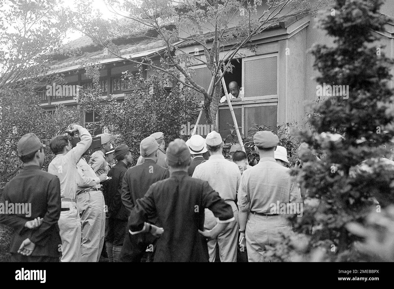 Hideki Tojo, former Japanese prime minister, looks out the window of ...