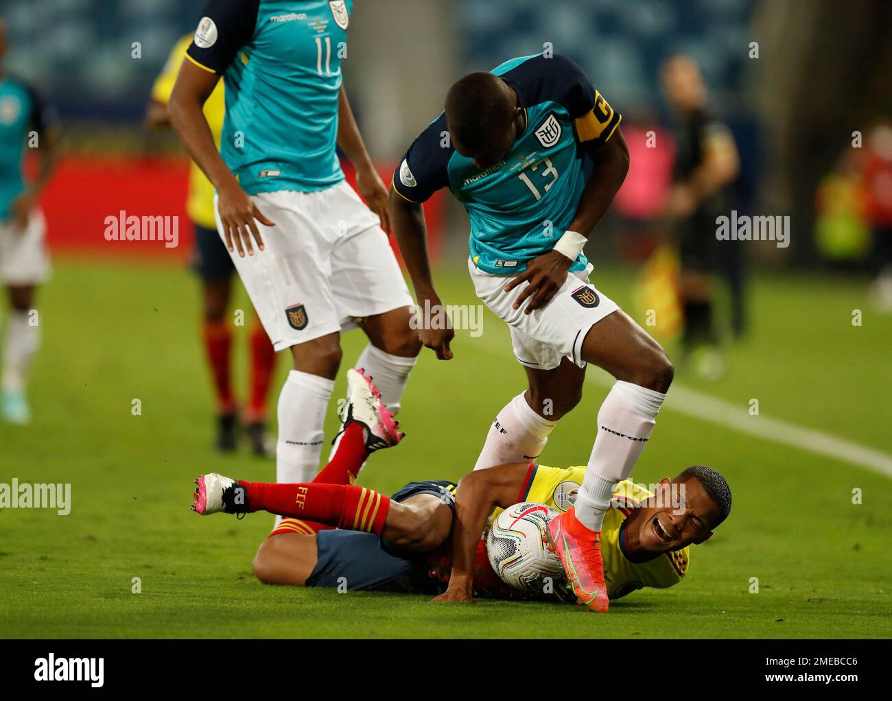 Colombia's Wilmar Barrios, bottom, lays on the ground in pain during a ...