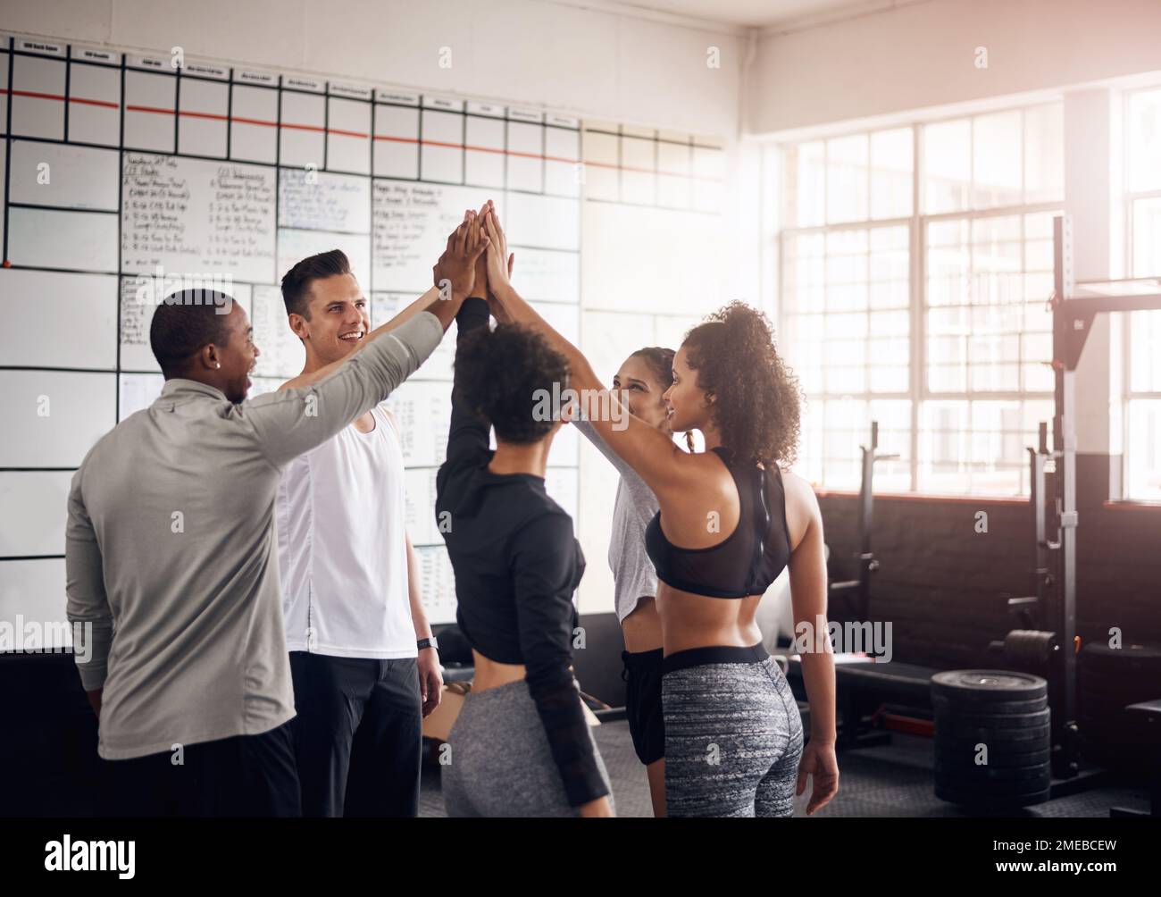 To conquer youve got to commit. a group of young people giving each ...