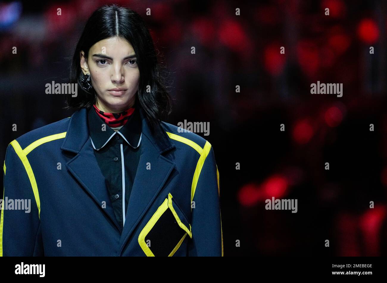 A model wears a creation as part of the Ferrari women's and men's ...