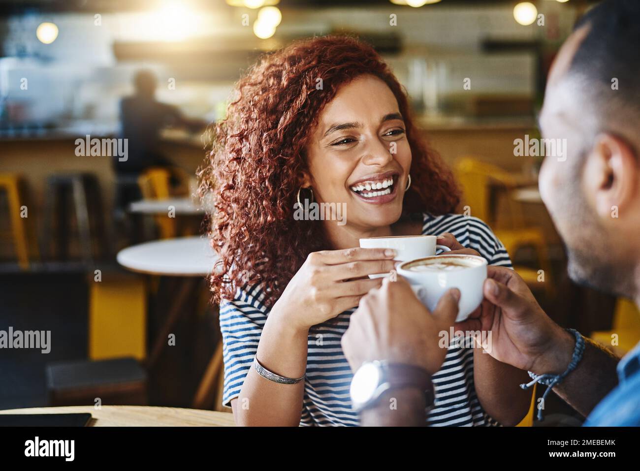 Heres to many more coffee dates with you. a happy young couple sitting ...
