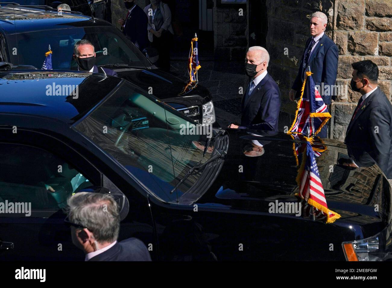 U.S. President Joe Biden, centre, departs after attending Mass at ...