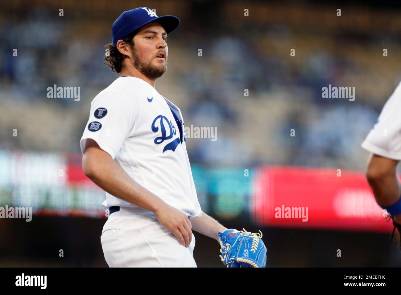 Los Angeles Dodgers starting pitcher Trevor Bauer covers first base ...