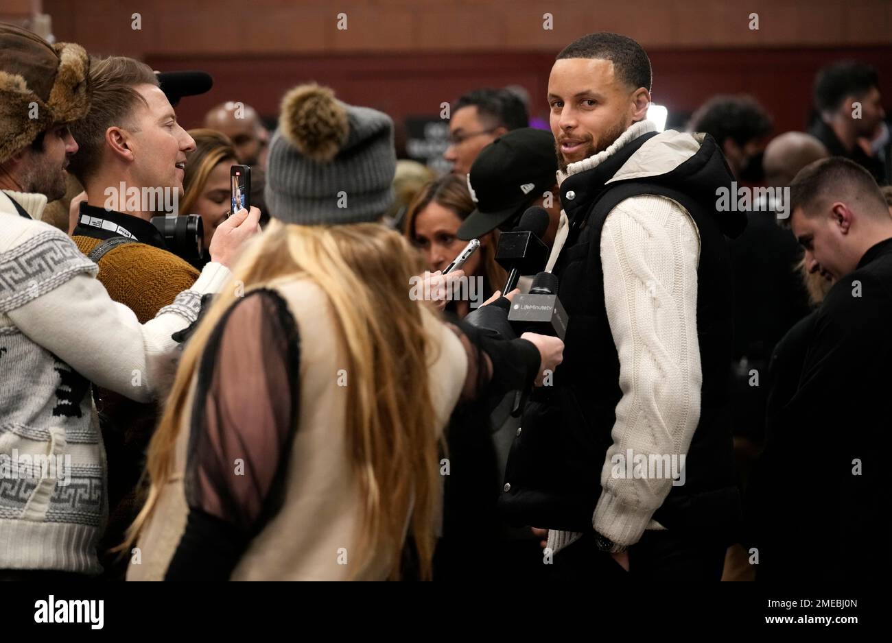 Golden State Warriors NBA basketball player Stephen Curry, right, the subject of the documentary ...