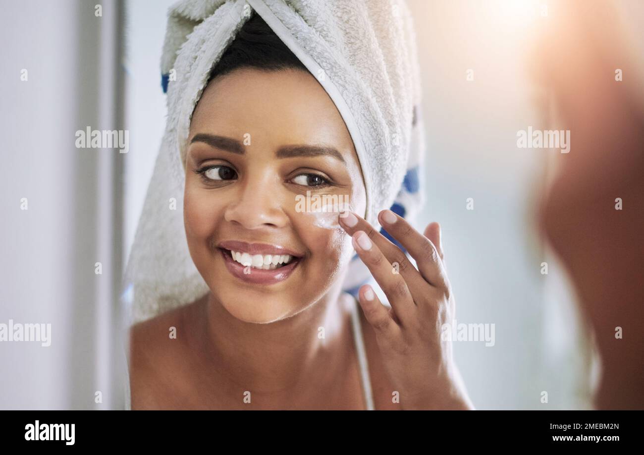 Give your skin the nourishment it loves. an attractive young woman ...