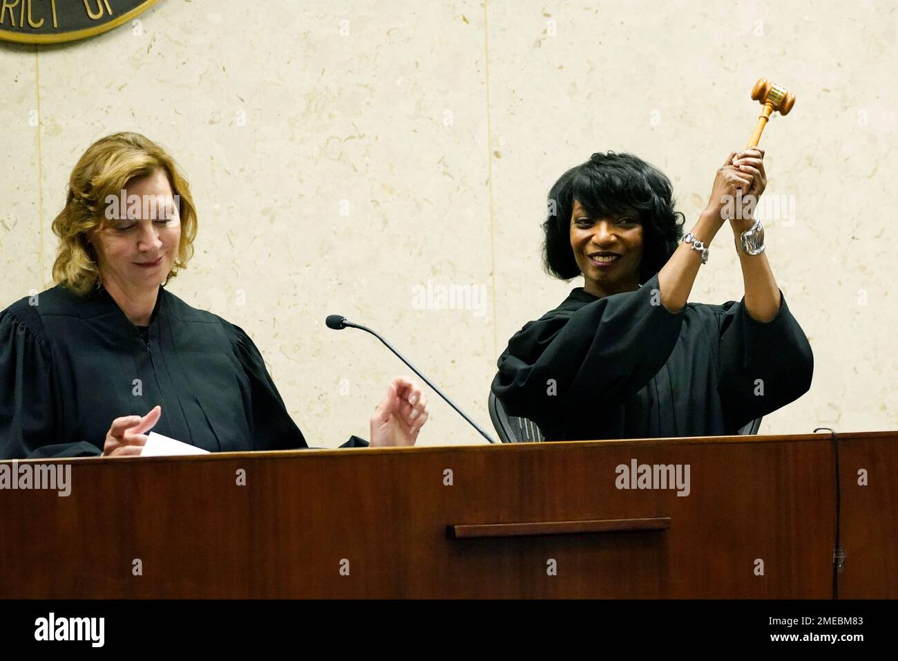 New U.S. District Chief Judge Debra M. Brown, right, waves the gavel given to her by outgoing ...