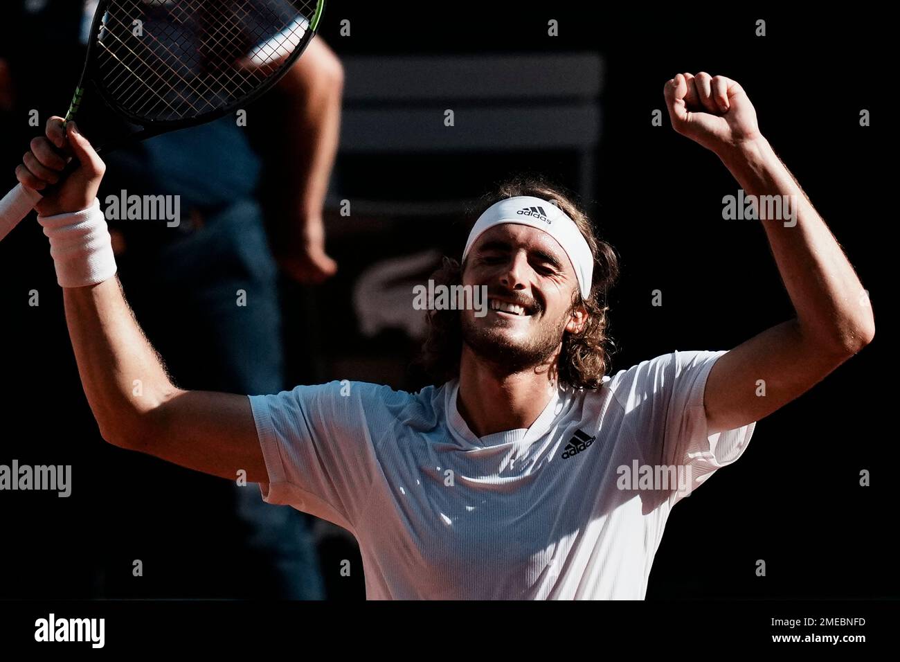 Stefanos Tsitsipas of Greece raises his arms as he defeats Germany's ...