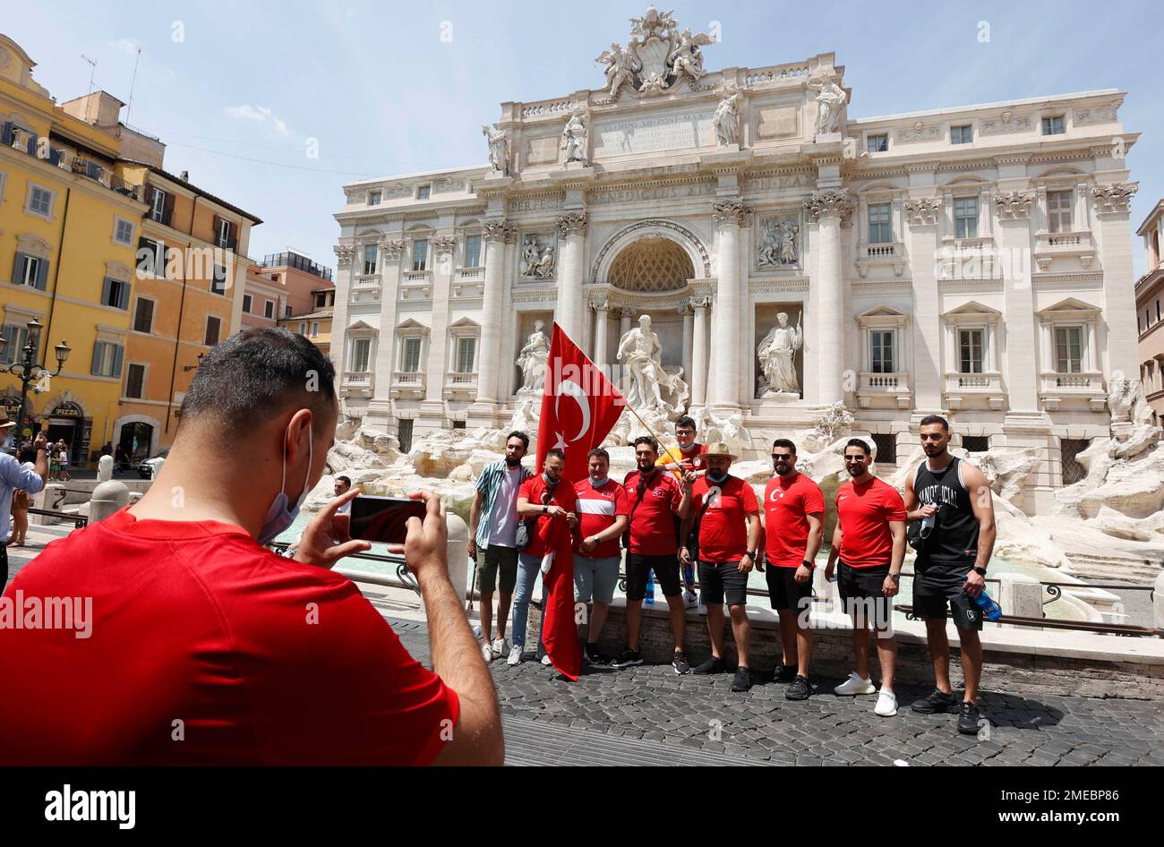 Turkish fans pose for photographs in front of the Trevi Fountain hours ...