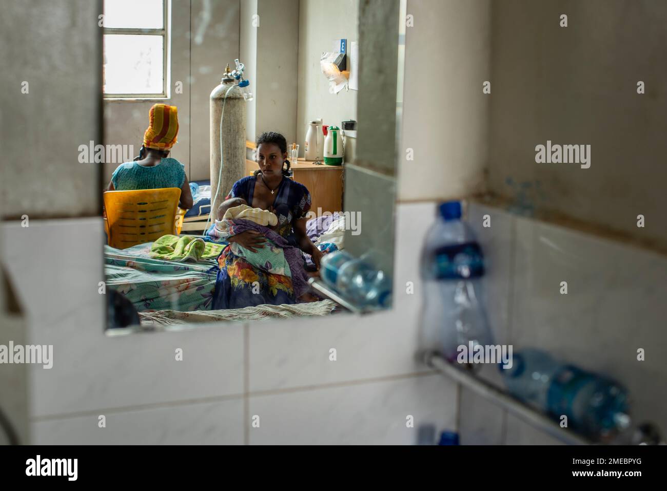 Tekien Tadese, 25, holds her baby, Amanuel Mulu, 22 months old, who is ...