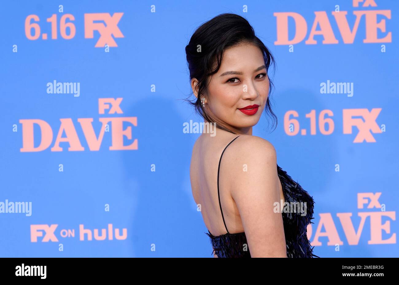 Cast member Christine Ko poses at the season two premiere of the FXX ...