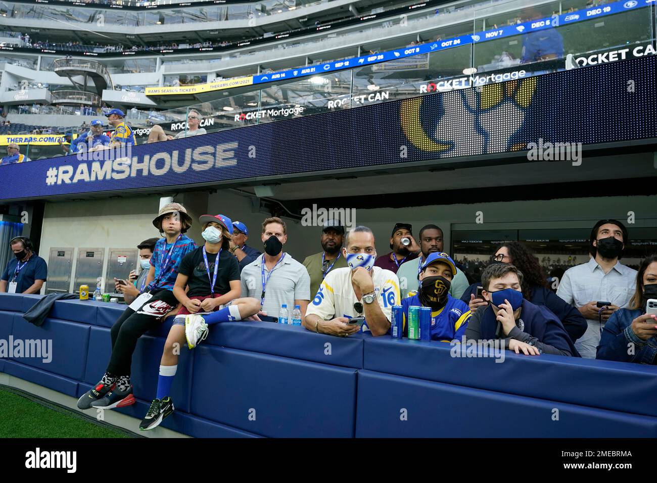 Fans wear masks as they watch the Los Angels Rams during NFL football ...