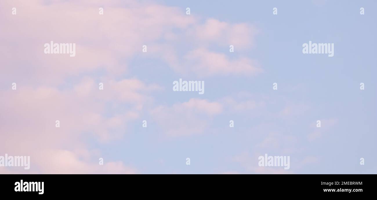Blue sky background with white and pink clouds at sunset. High quality ...