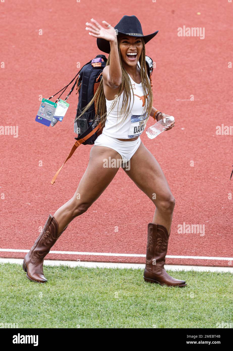 Texas' Tara Davis waves while wearing cowboy boots and hat during her ...