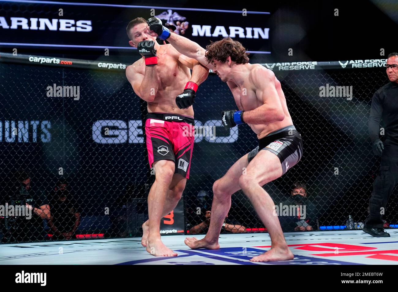 Olivier Aubin-Merciert, right, hits Marcin Held during a Professional ...