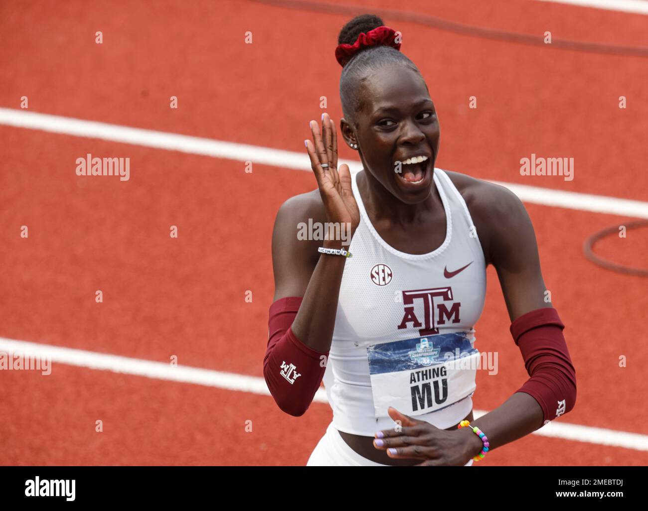 Texas A&M's Athing Mu celebrates after winning her heat of the women's ...