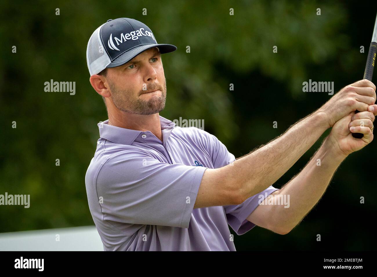 Wes Roach watches his drive off the ninth tee during the first round of ...