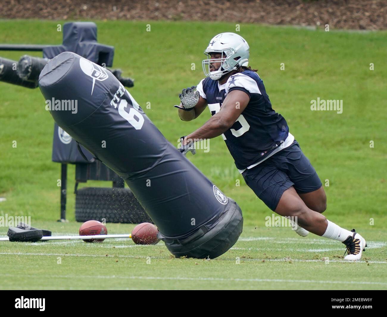 Dallas Cowboys Osa Odighizuwa runs a drill during an NFL football team ...