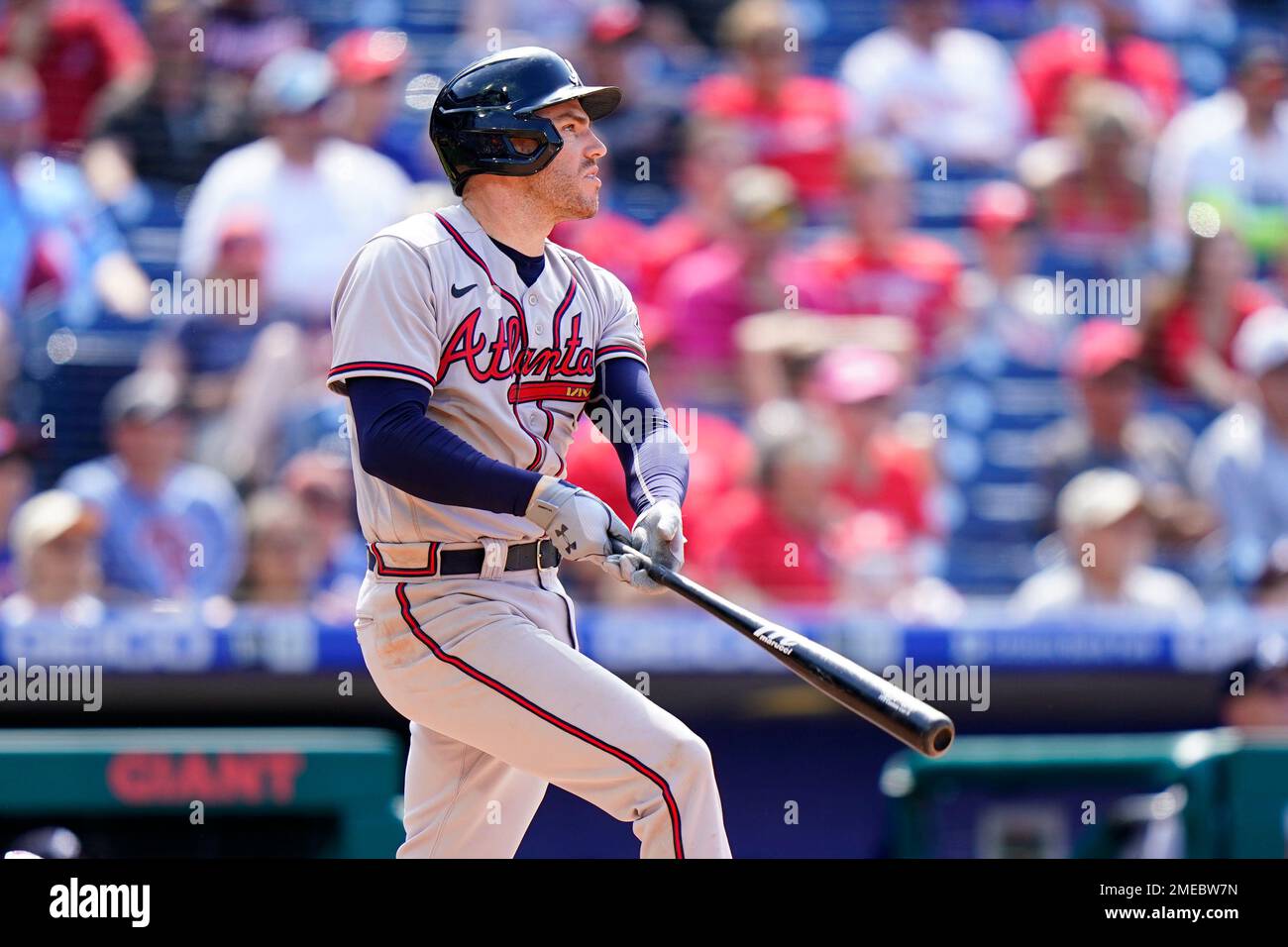 Atlanta Braves' Freddie Freeman follows through after hitting a home ...