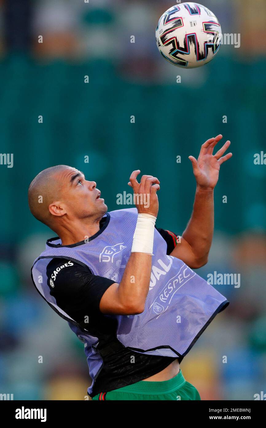 Portugal's Pepe eyes a ball during warmup before the international ...