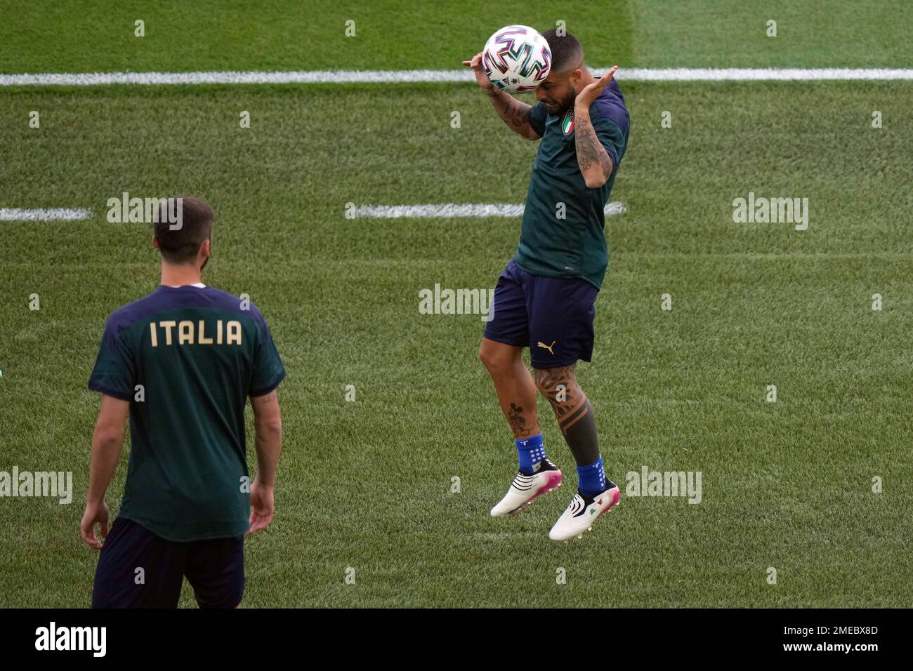 Italy's Lorenzo Insigne heads the ball during a training session ahead ...