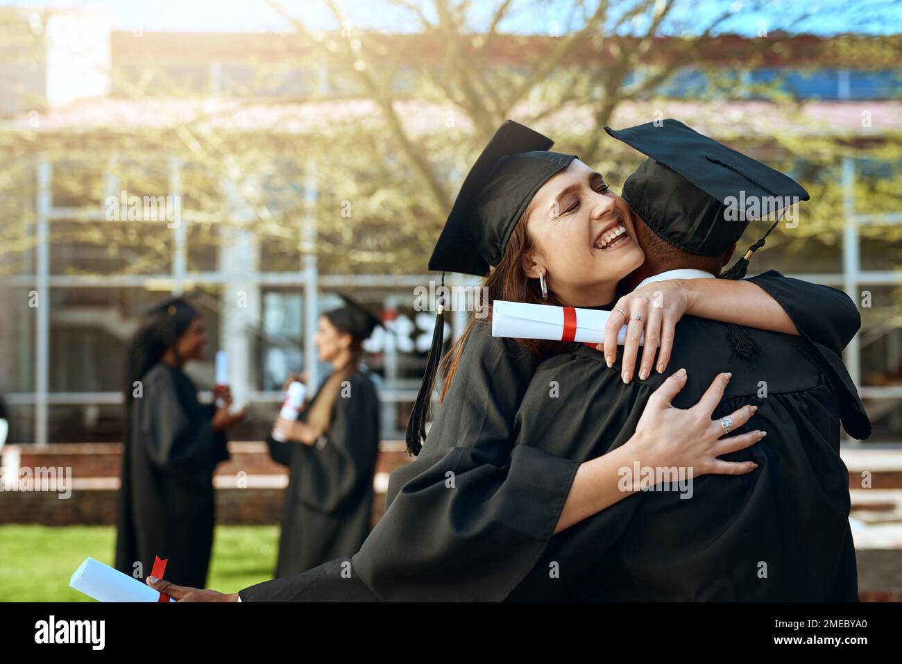 College couple hugging hi-res stock photography and images - Alamy