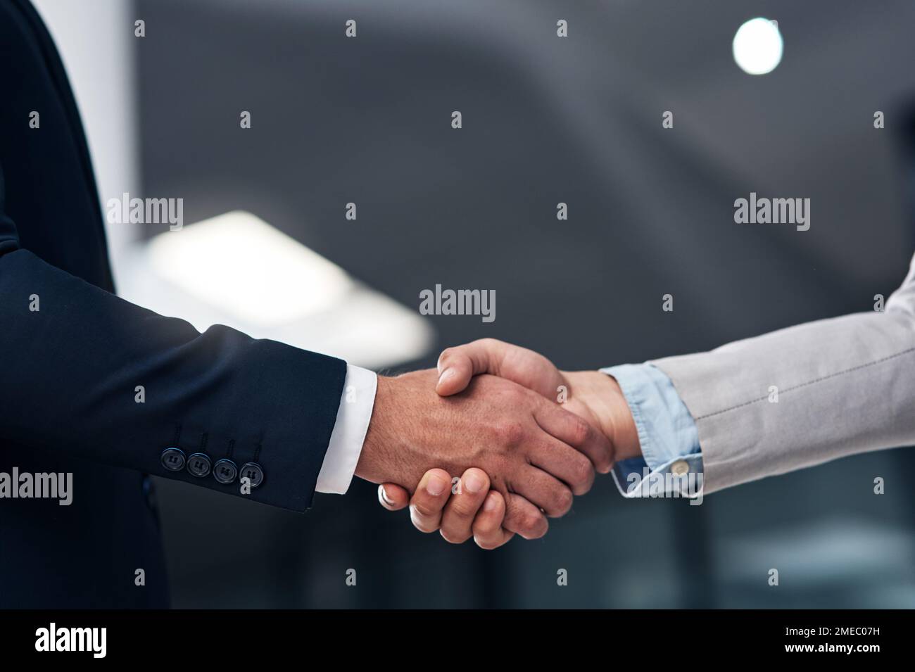 When you work together you win together. two businessmen shaking hands ...