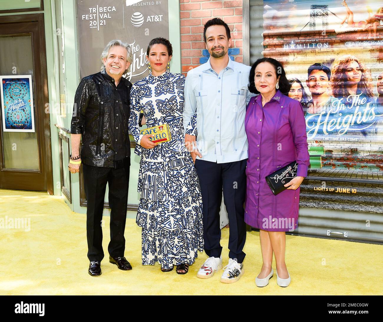 Producer Lin-Manuel Miranda, second from right, poses with his father ...