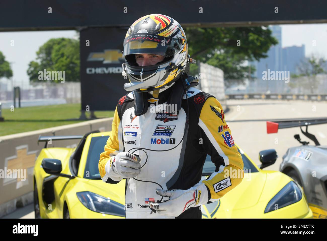 Race dar driver Tommy Milner exits a Corvette C8.R race car before the ...