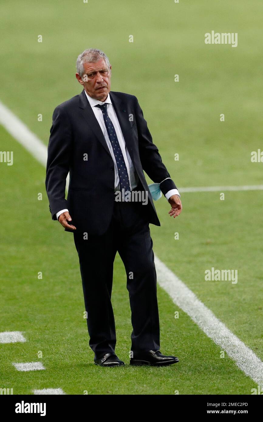 Portugal coach Fernando Santos gestures as he follows the action during ...