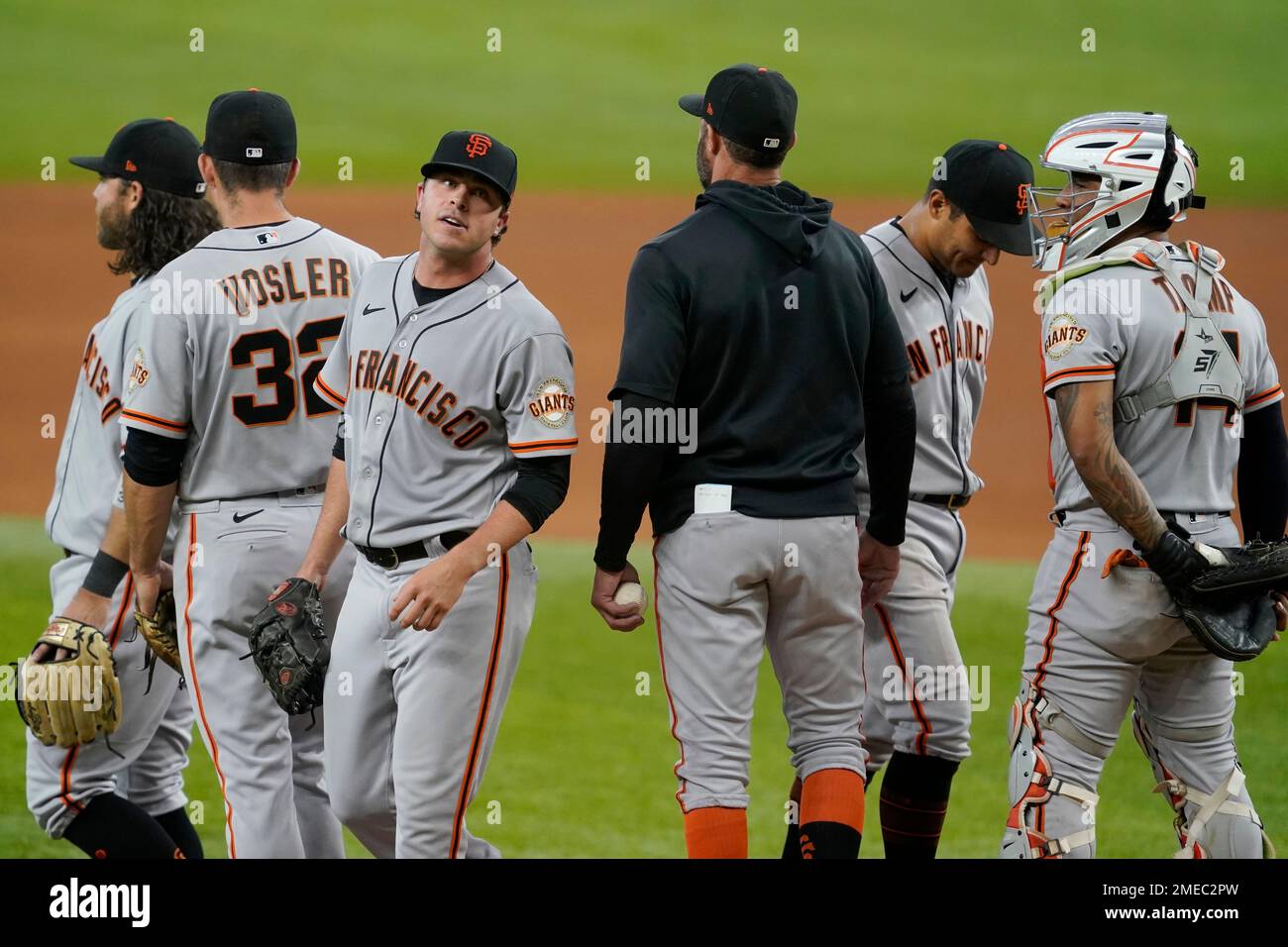 San Francisco Giants relief pitcher Sammy Long, third from left, leaves ...