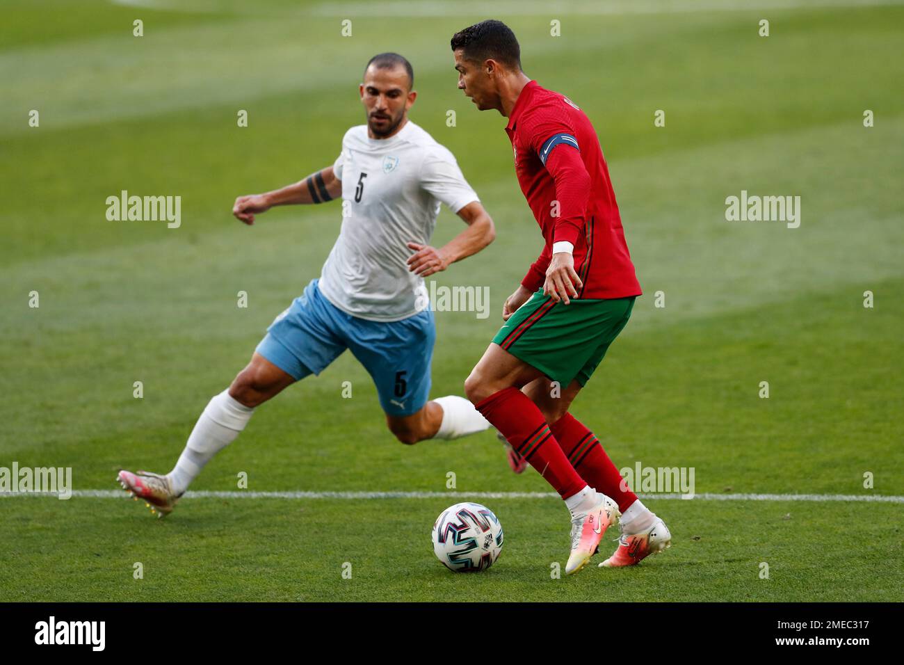 Portugal's Cristiano Ronaldo, right, vies for the ball with Israel's ...